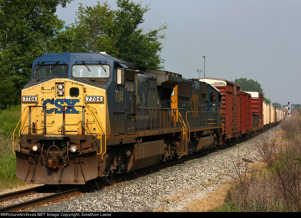 CSX 7704 and 8581 lead 83 cars of Q335 into Grand Rapids